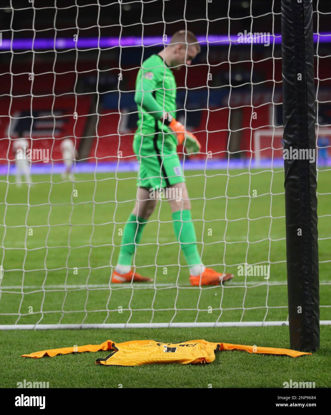 A view of England's goalkeeper Jordan Pickford and a shirt on the pitch ...