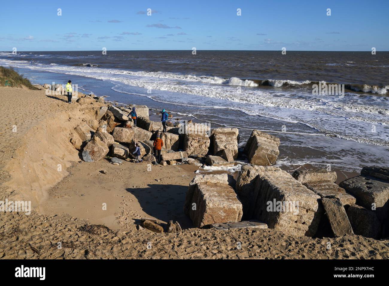 People climb off the beach at Hemsby in Norfolk, which has been closed ...