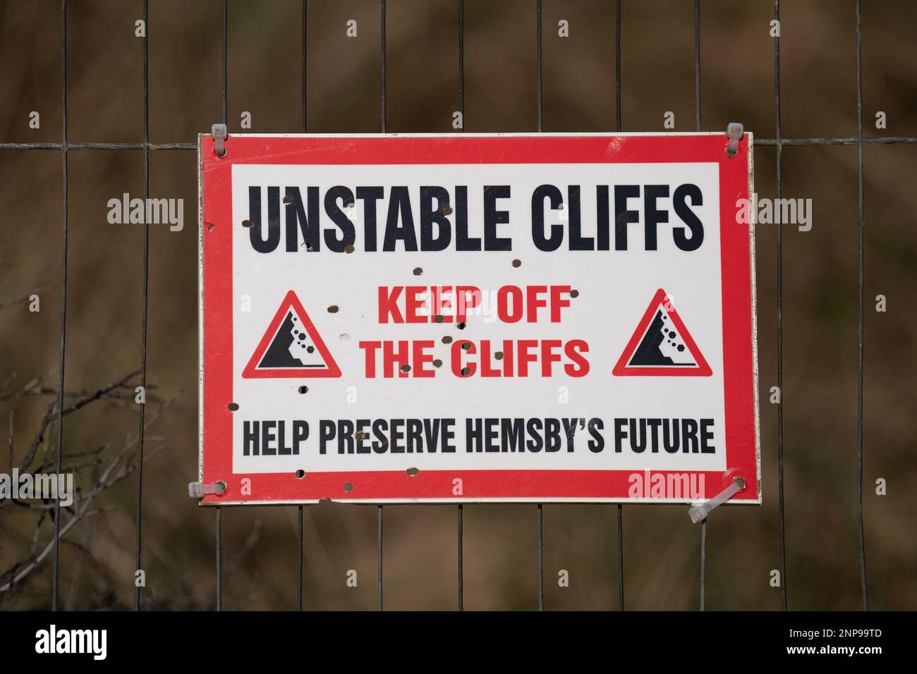A sign on the cliffs at Hemsby in Norfolk, where the beach has been ...