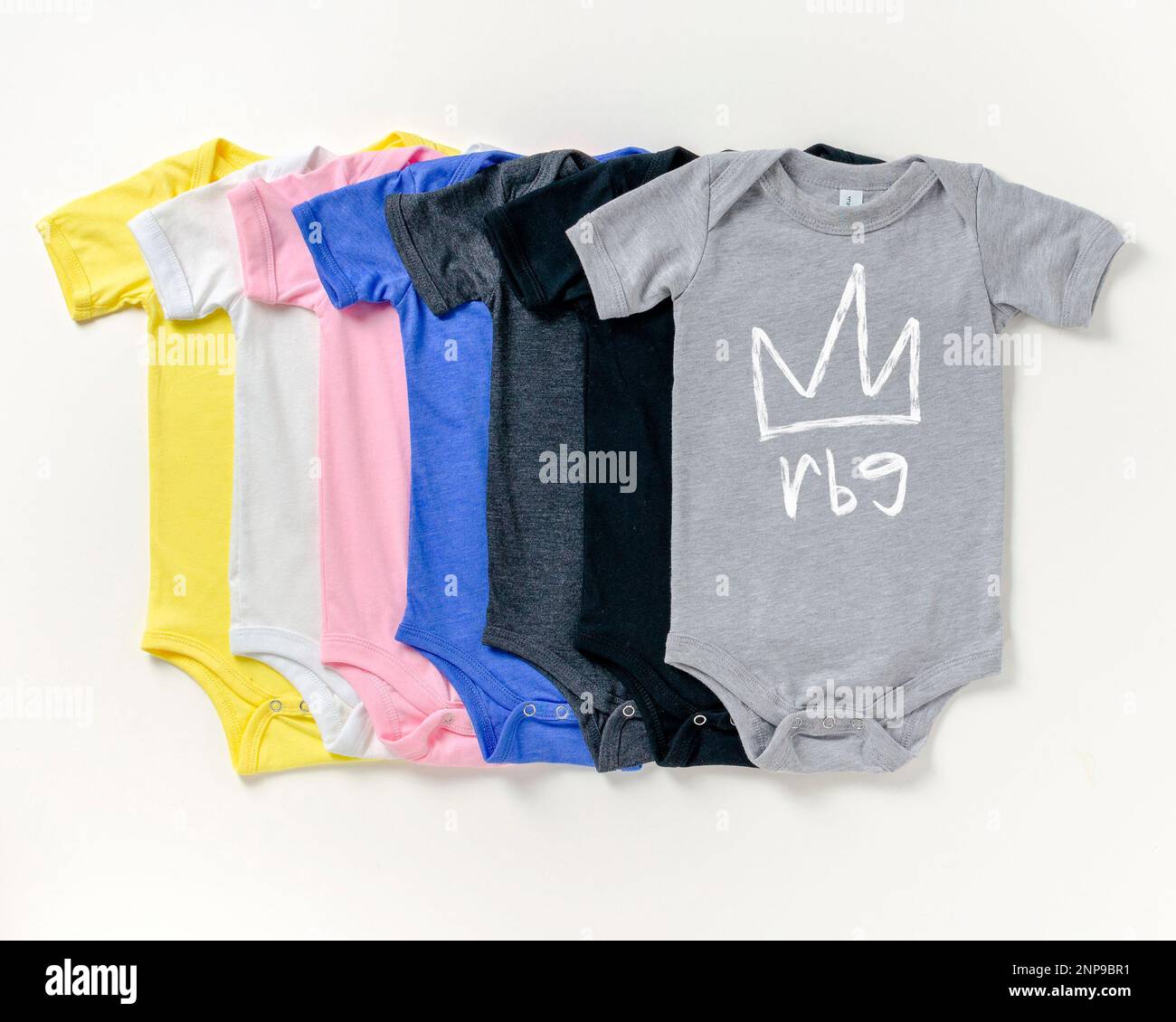 This image shows a variety of onesies with a line drawing of a crown ...