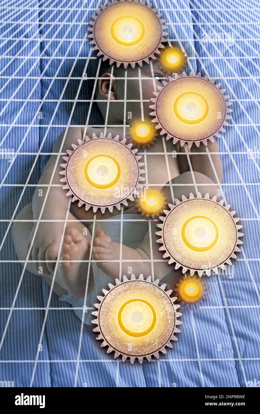 INTERLOCKING COG GEARS ABOVE INFANT BABY LAYING DOWN Stock Photo - Alamy