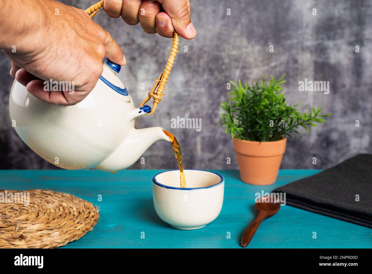 Herbal tea hands table hi-res stock photography and images - Alamy