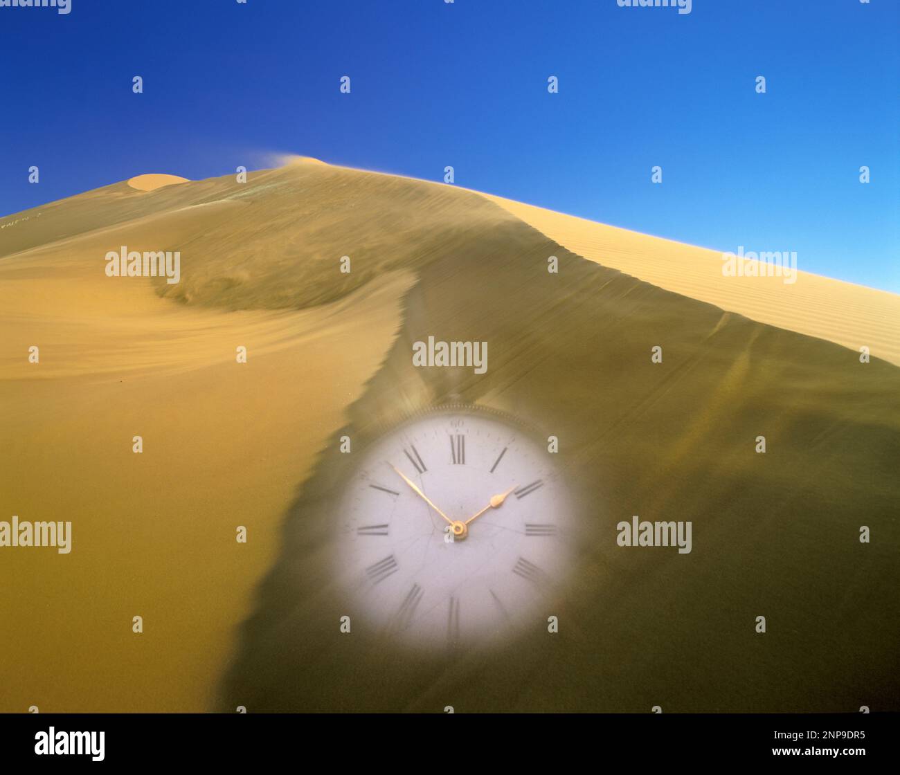 OLD FASHIONED POCKET WATCH SUPERIMPOSED ON WIND STORM GIANT DESERT SAND ...