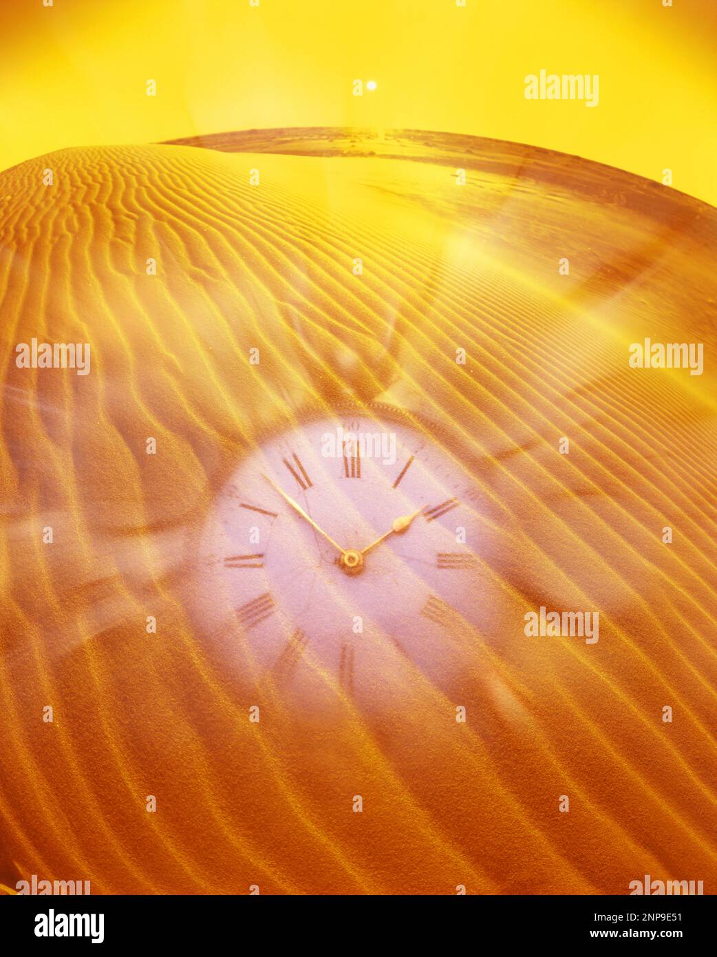 OLD FASHIONED POCKET WATCH SUPERIMPOSED ON RIPPLES IN BIG SAND DUNE ...