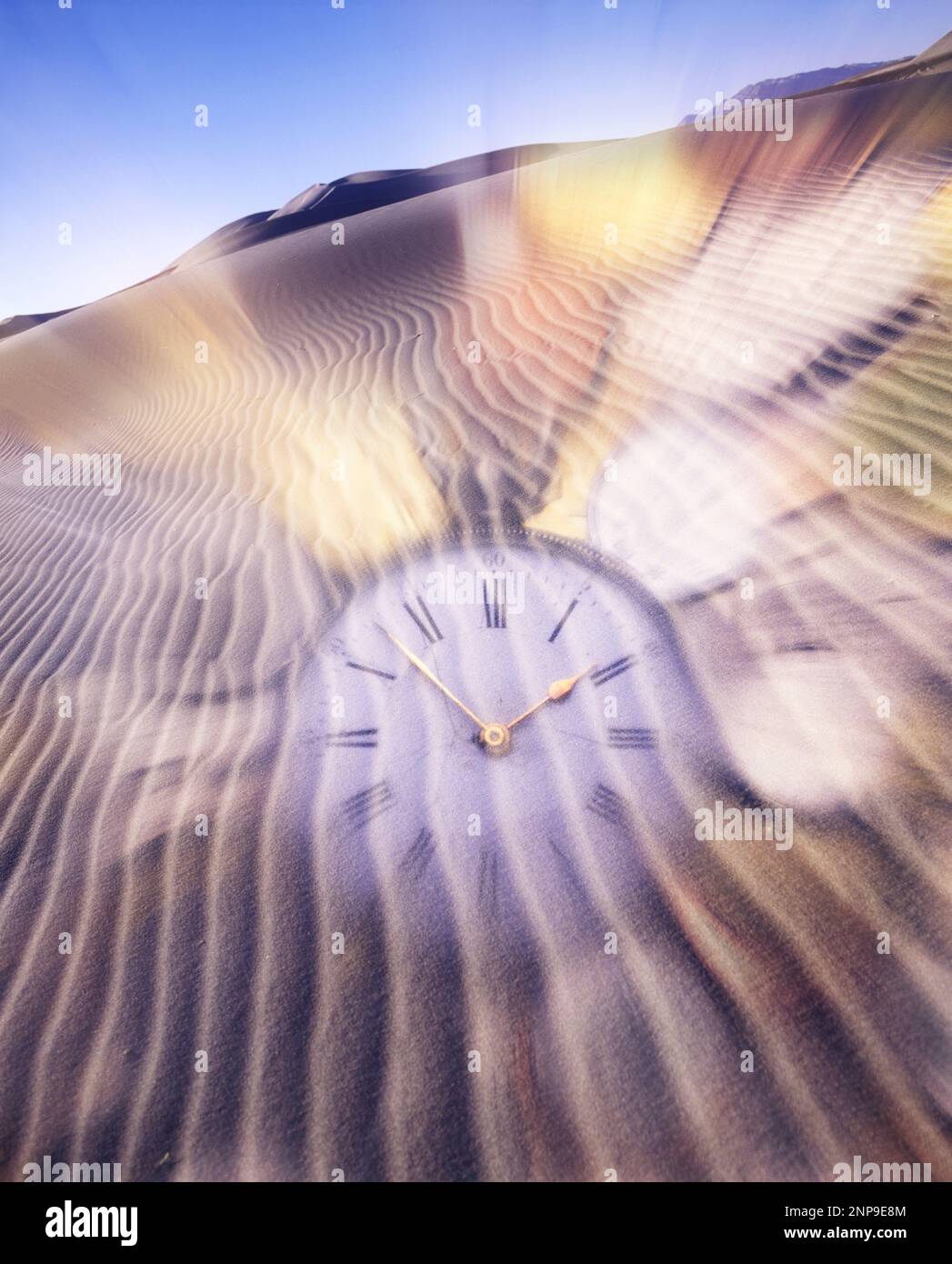 OLD FASHIONED POCKET WATCH SUPERIMPOSED ON RIPPLES IN BIG SAND DUNE ...