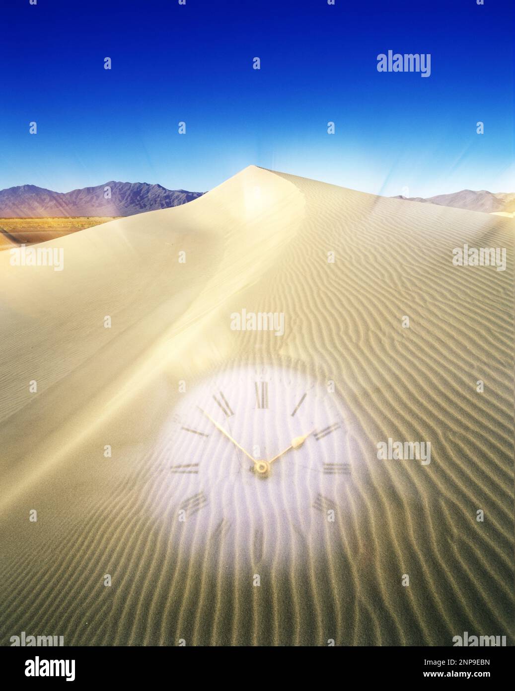 OLD FASHIONED POCKET WATCH SUPERIMPOSED ON RIPPLES IN BIG SAND DUNE ...