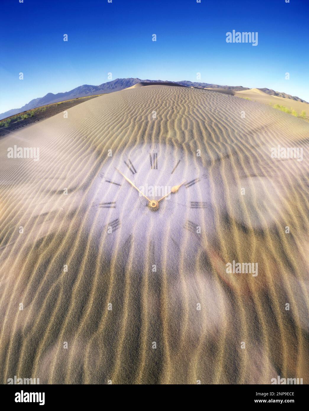 OLD FASHIONED POCKET WATCH SUPERIMPOSED ON RIPPLES IN BIG SAND DUNE ...