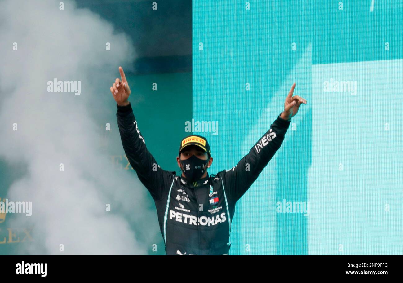 Mercedes driver Lewis Hamilton of Britain celebrates on the podium ...