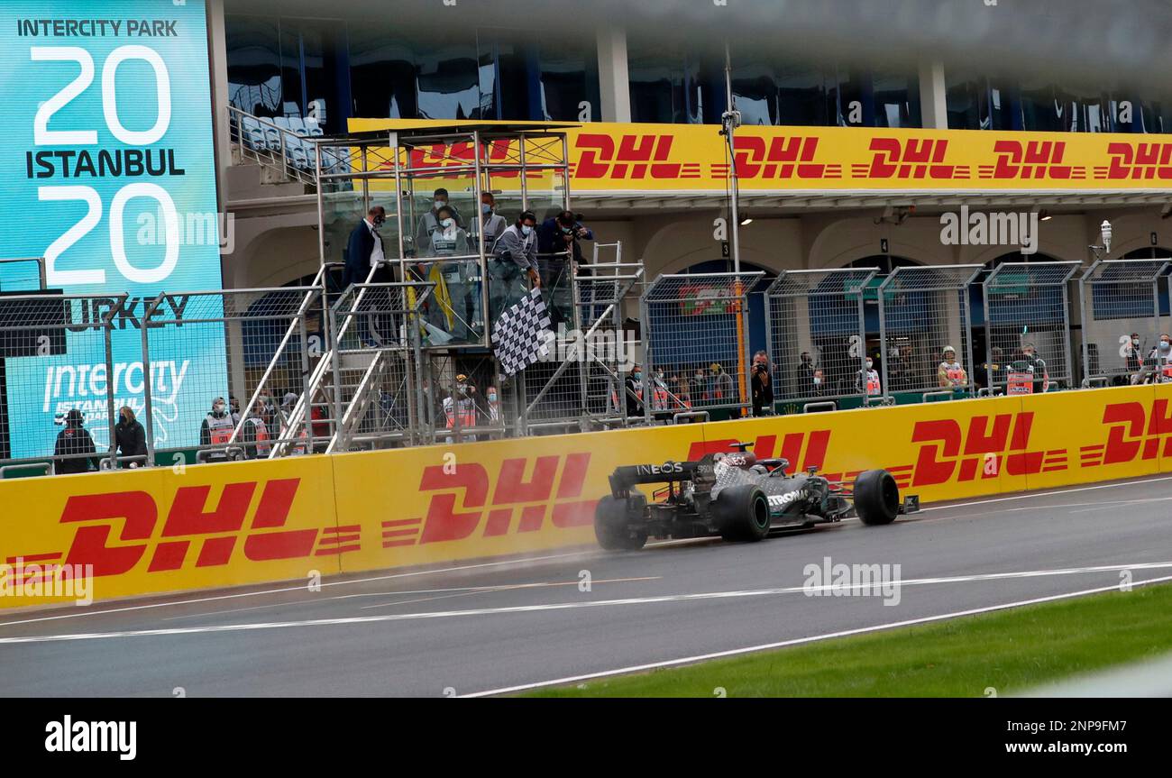 Mercedes driver Lewis Hamilton of Britain crosses the finish line to ...