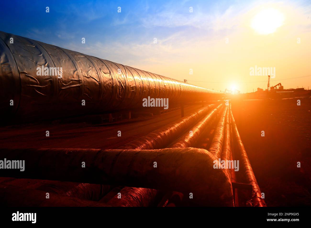 Oil pipes and valves Stock Photo - Alamy