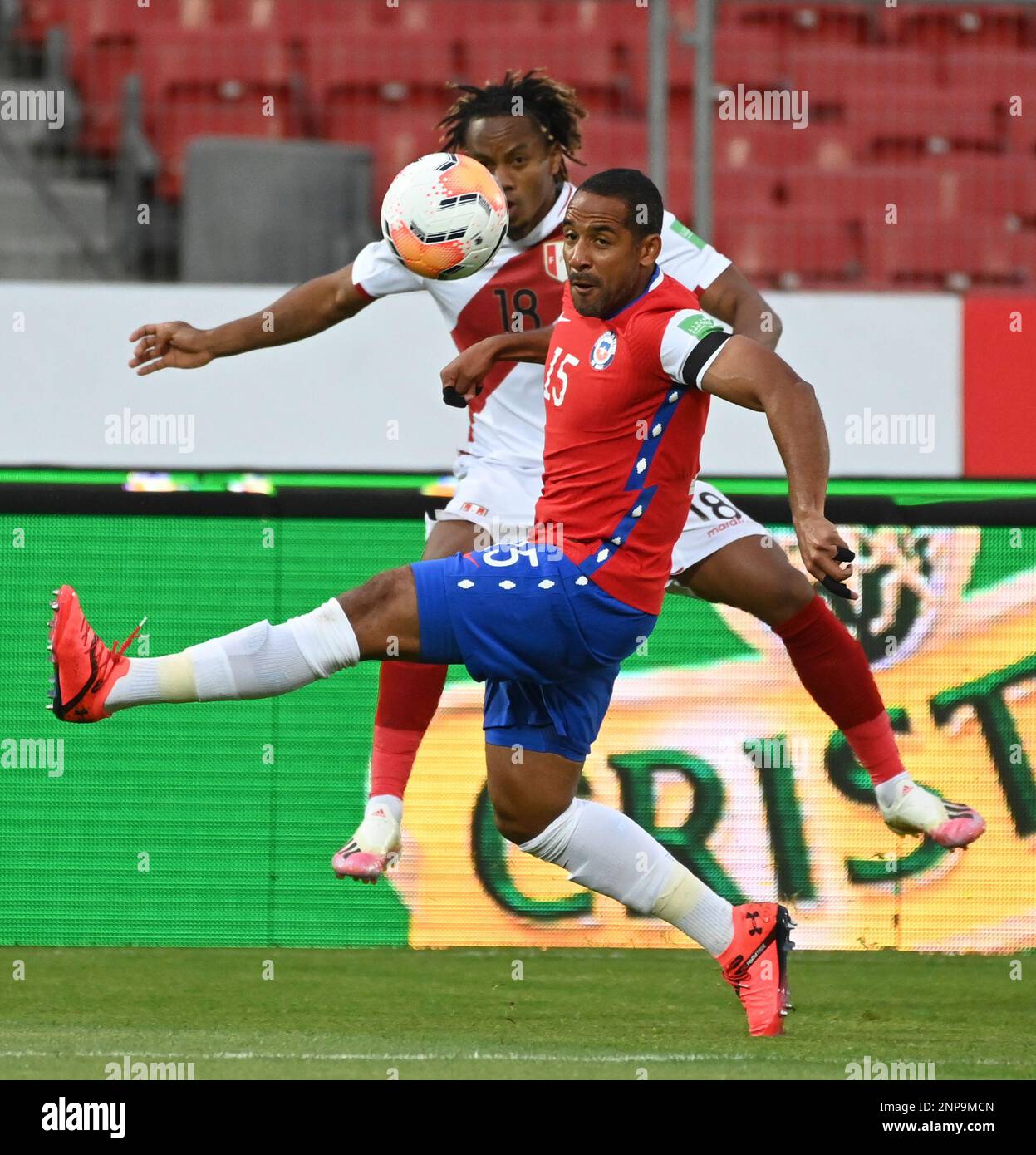 Chile's Jean Beausejour, and Peru's André Carrillo battle for the ball ...