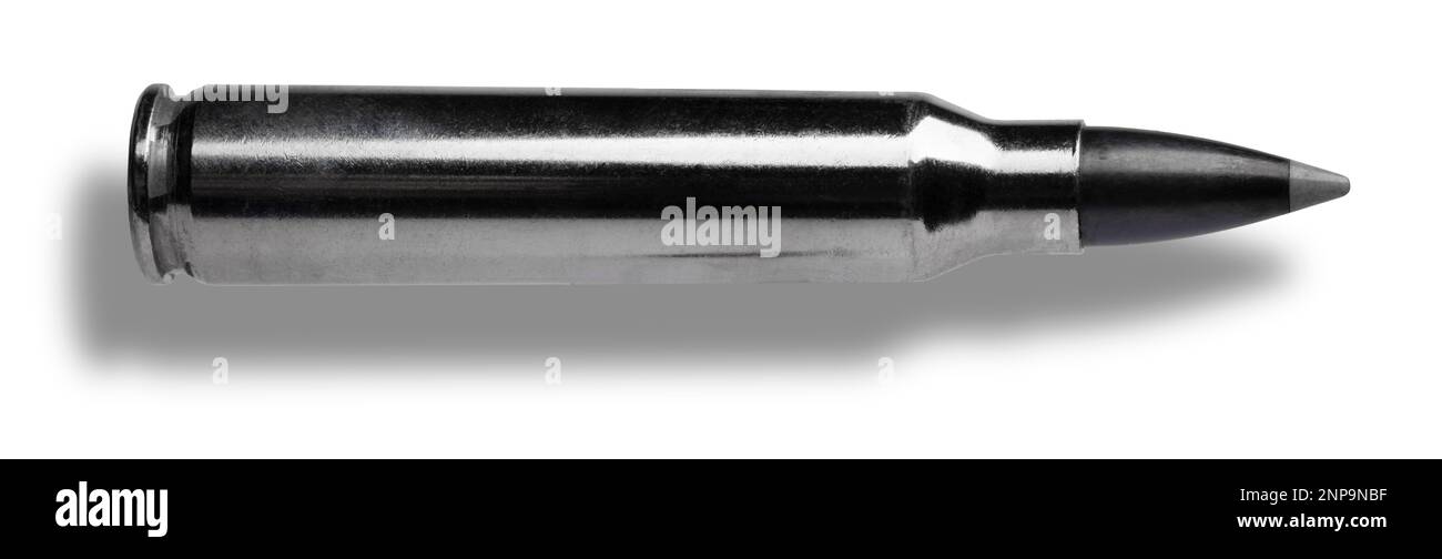 Shadow under an AR-15 cartridge with a black 223 caliber bullet and ...