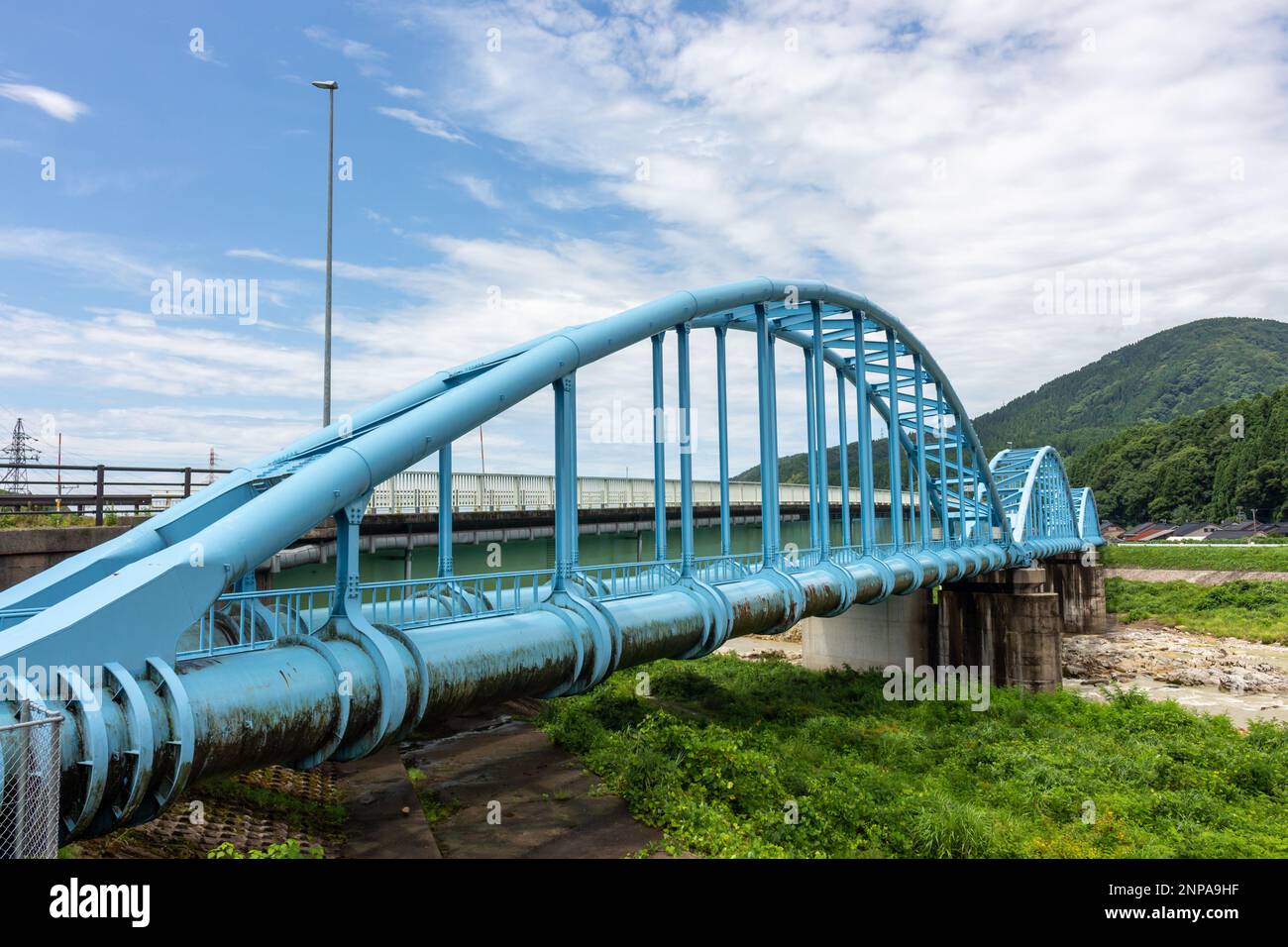 Pipeline bridge next to Wasadani Bridge over the Tedori river, Tsurugi ...