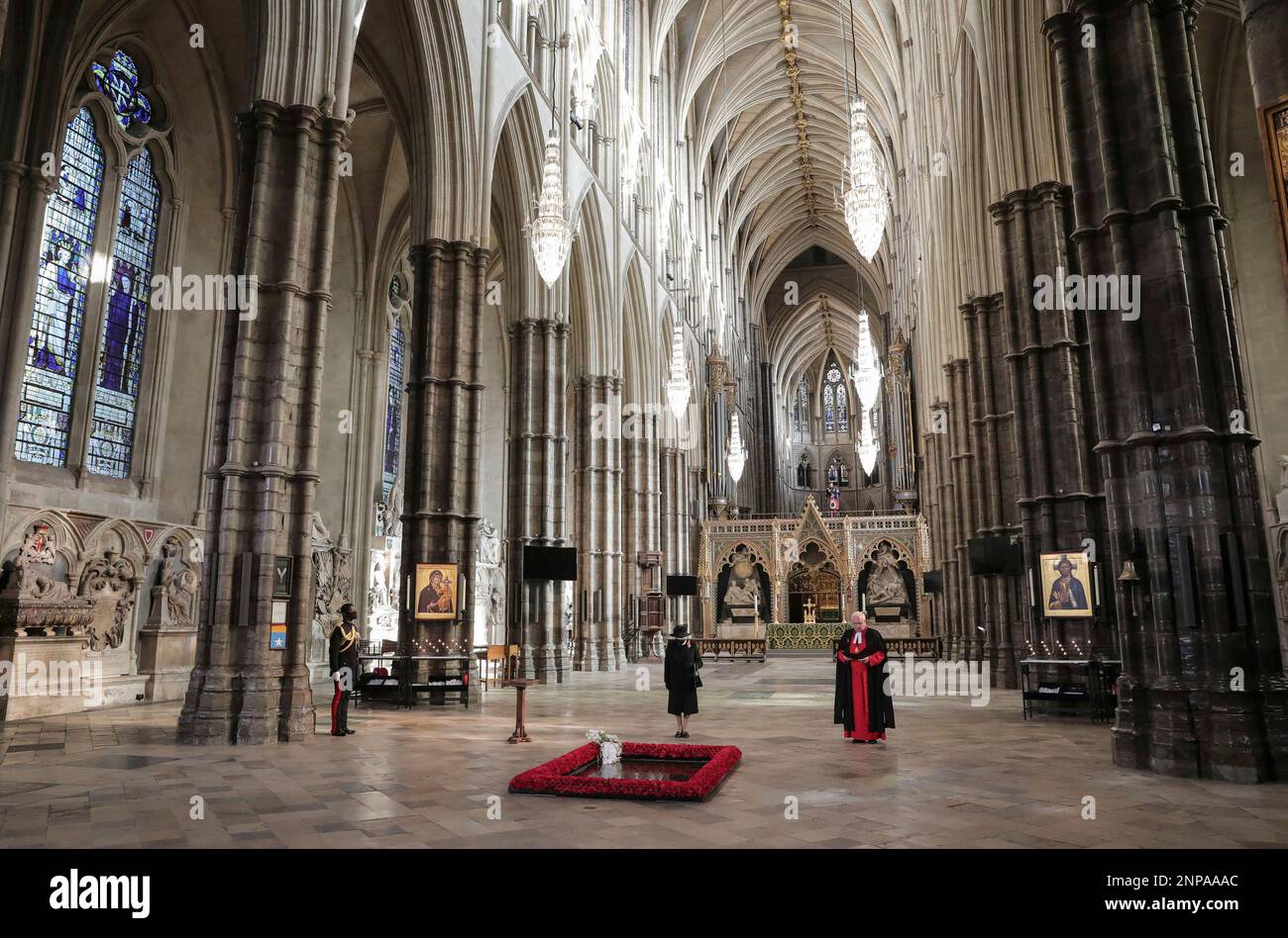 The Dean of Westminster Abbey David Hoyle, right, reads after the Queen ...