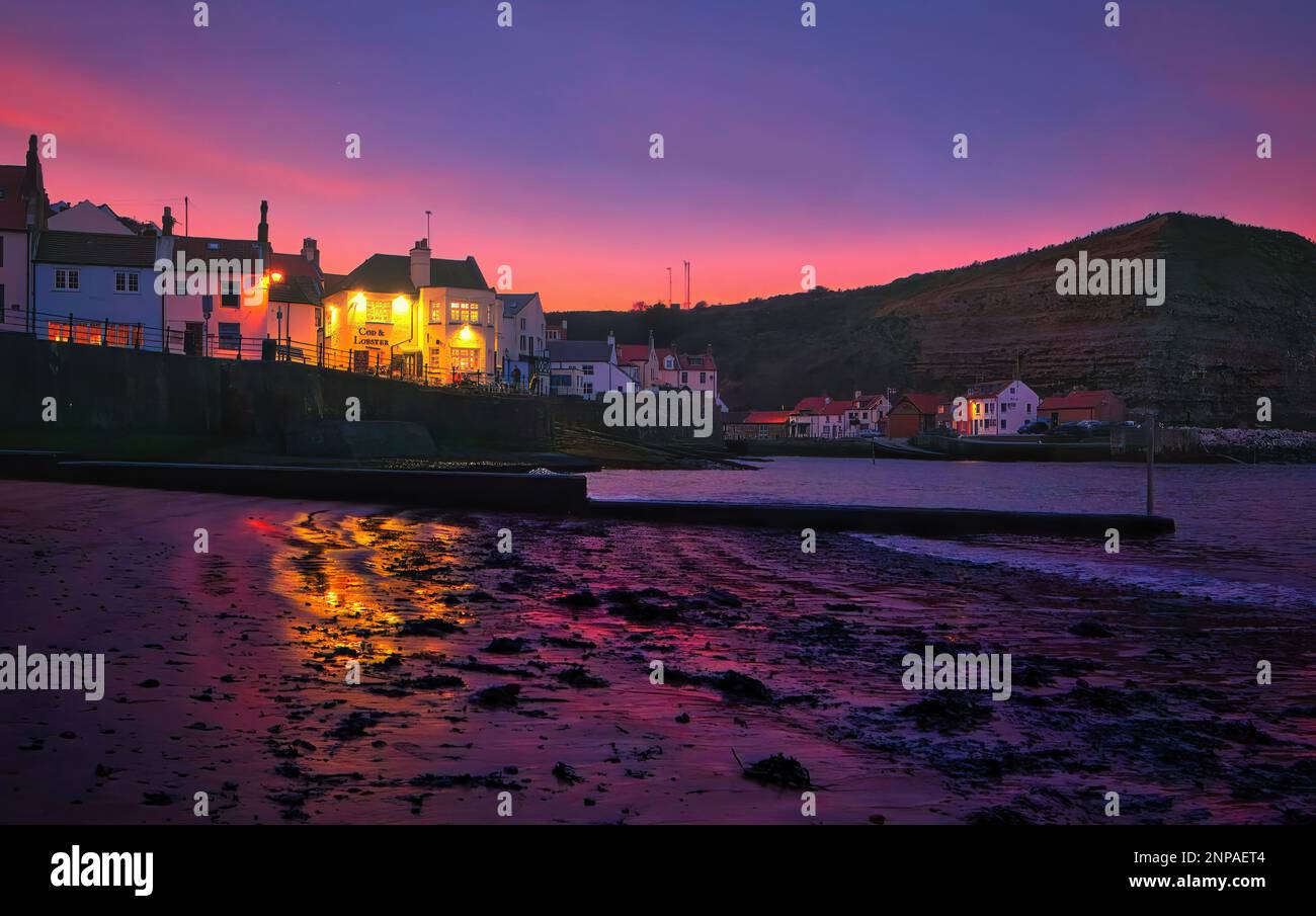 A winter sunset provides stunning colour over Staithes, with the Cod ...