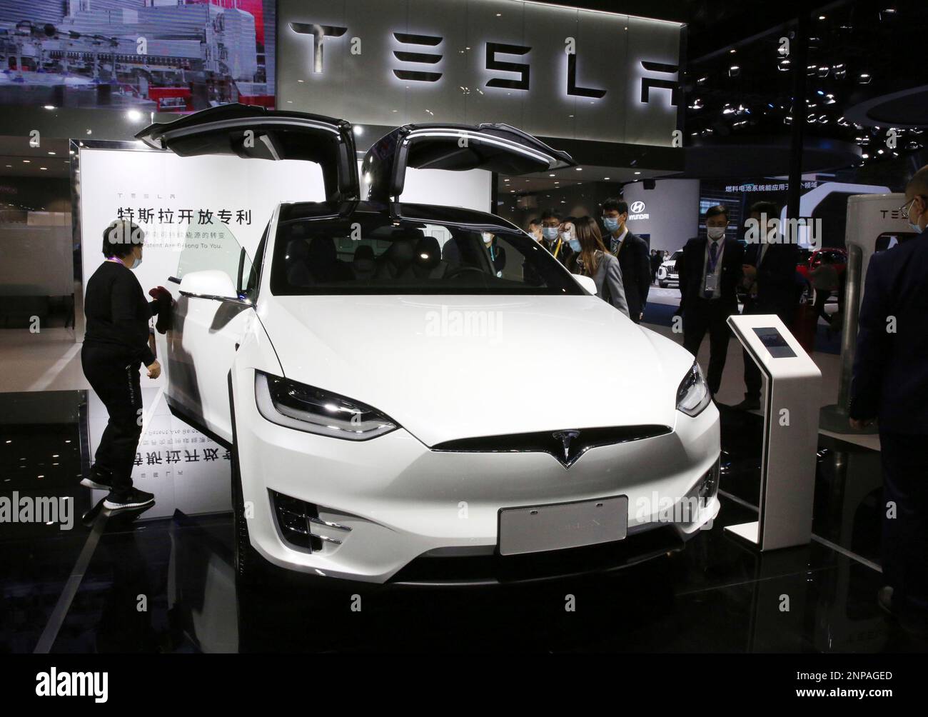 A booth of Tesla, an American electric vehicle company, is pictured ...