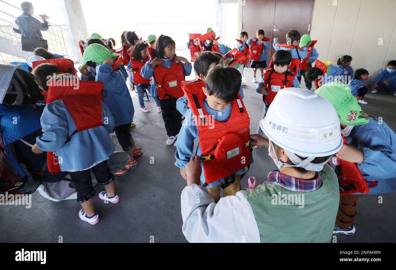 Local people take part in an evacuation drill in Kisosaki Town, Mie ...