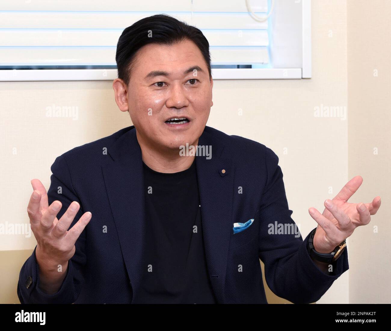 Hiroshi Mikitani, founder and CEO of Rakuten answers a quetion during ...