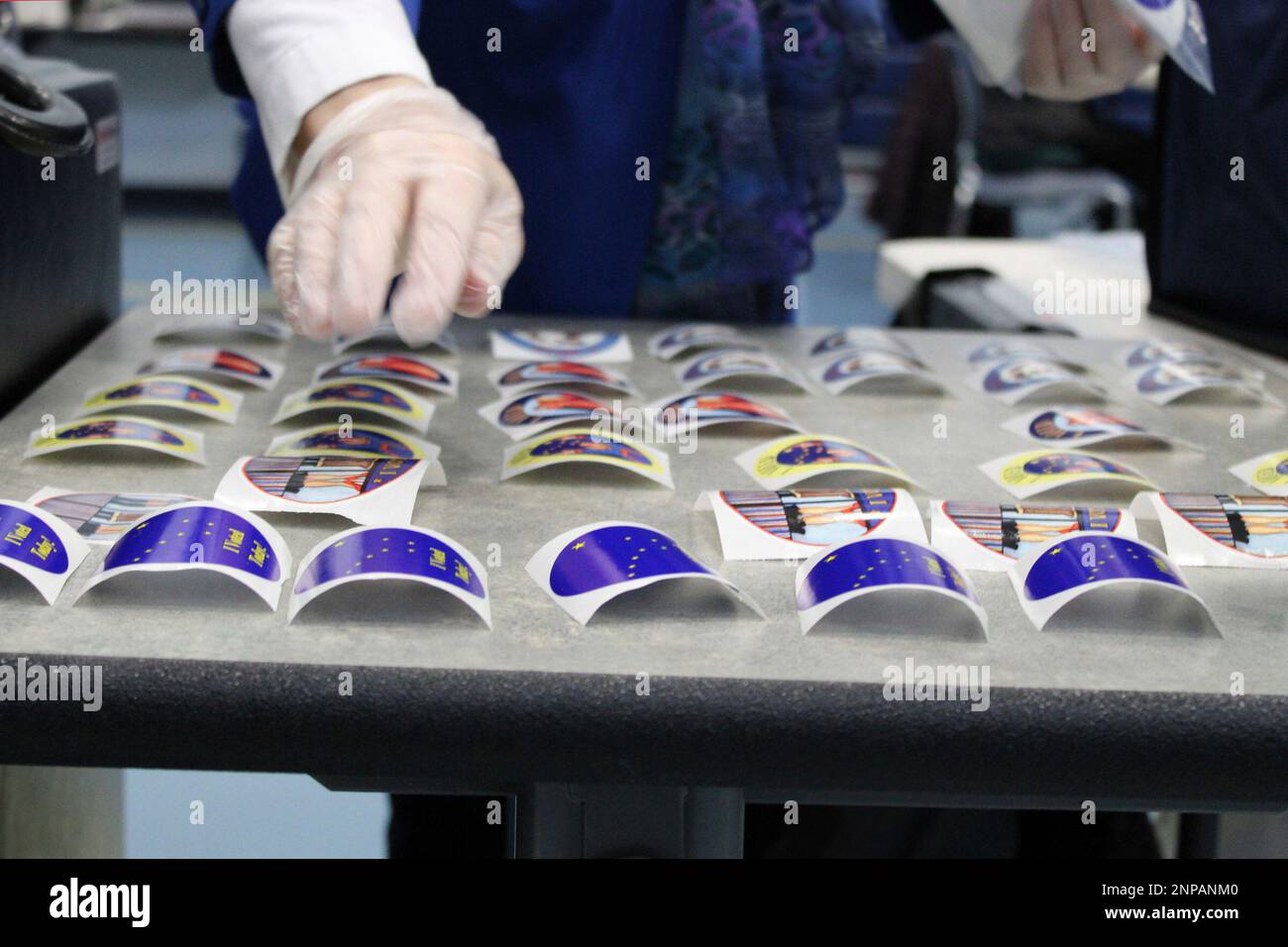 An election official lays out more "I voted" stickers on Election Day ...