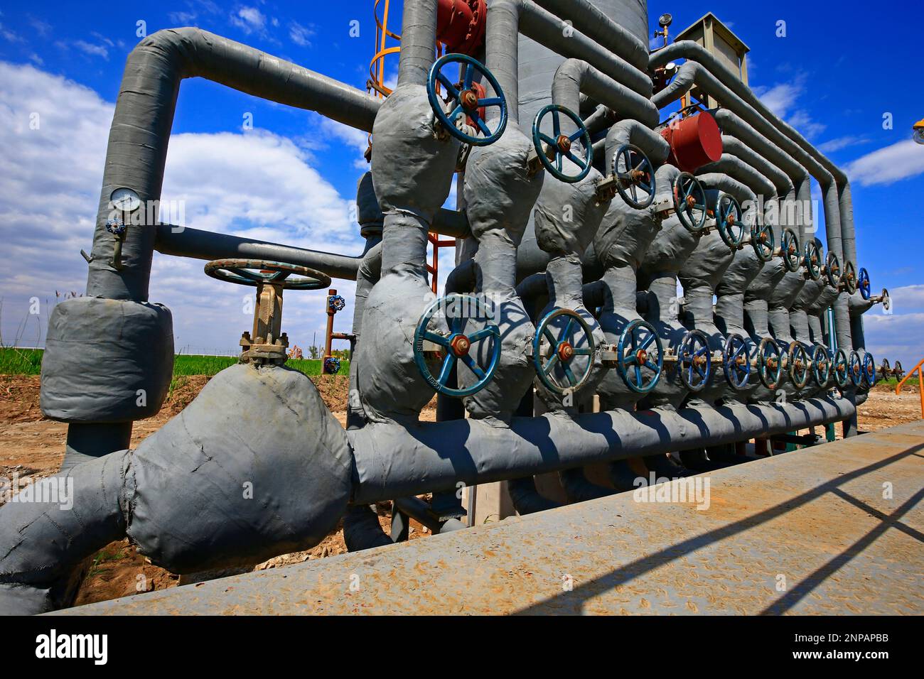 Oil pipes and valves Stock Photo - Alamy
