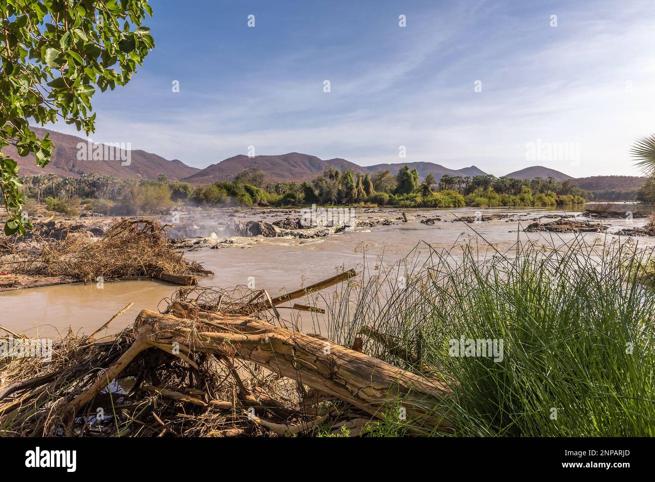 Landscape on the banks of the Kunene River, the border river between ...