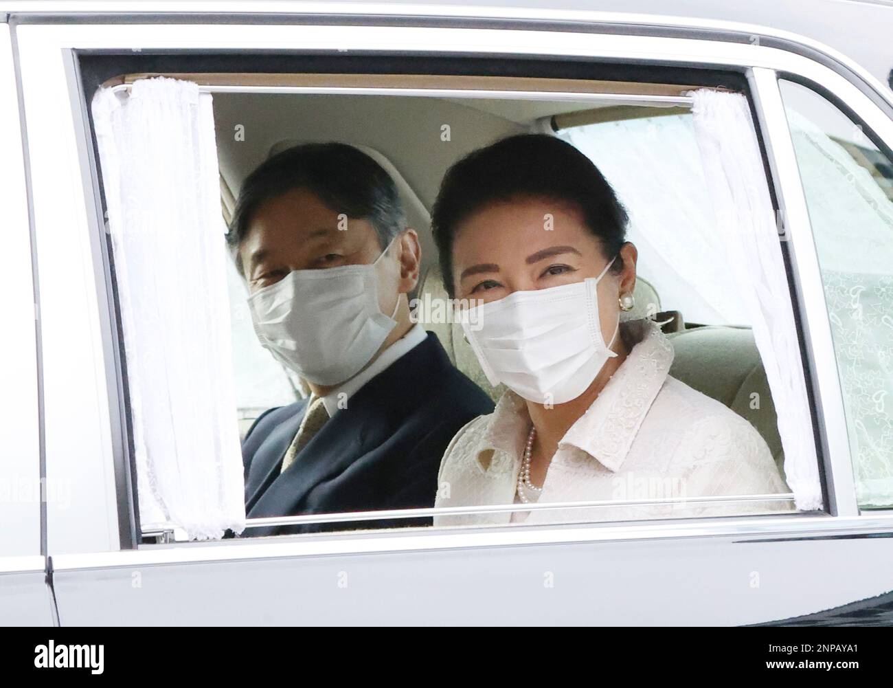 Japan's Emperor Naruhito and Empress Masako enter the Imperial Palace in Tokyo on November 2 ...