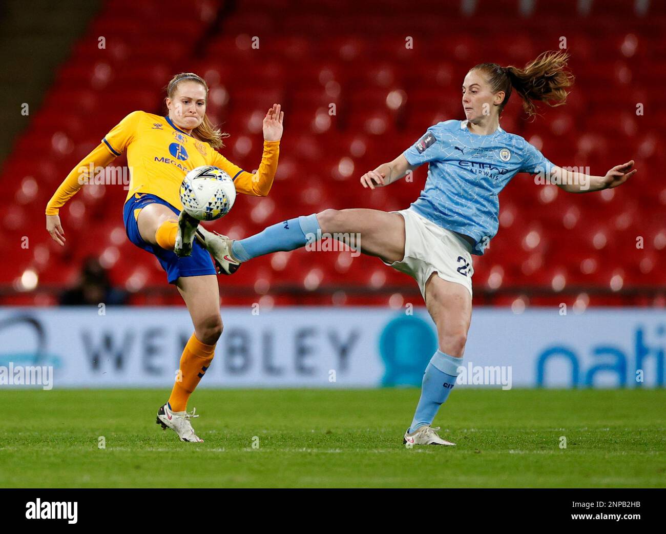 Everton's Molly Pike, left, duels for the ball with Manchester City's ...
