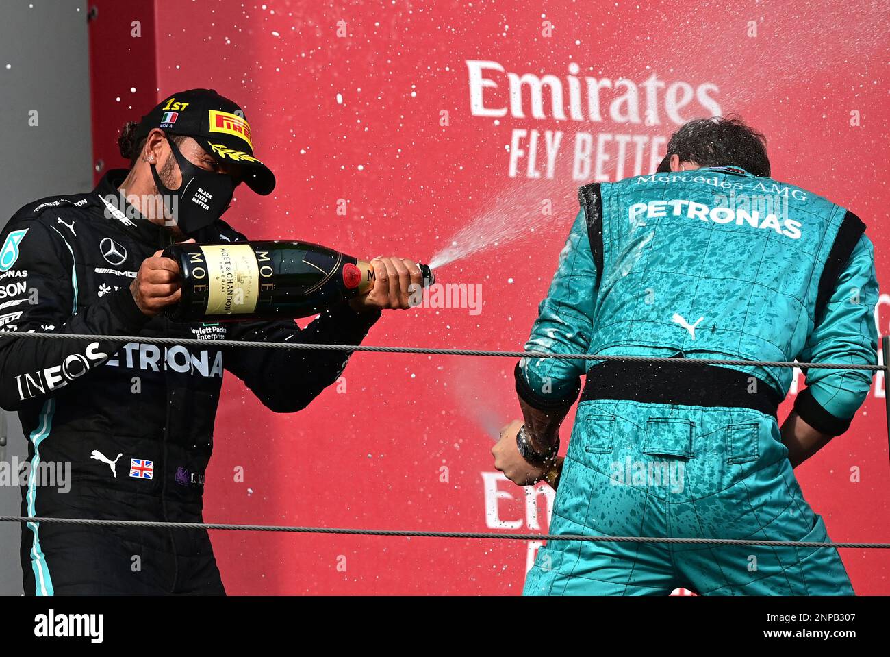 Mercedes driver Lewis Hamilton of Britain, left, celebrates on the ...