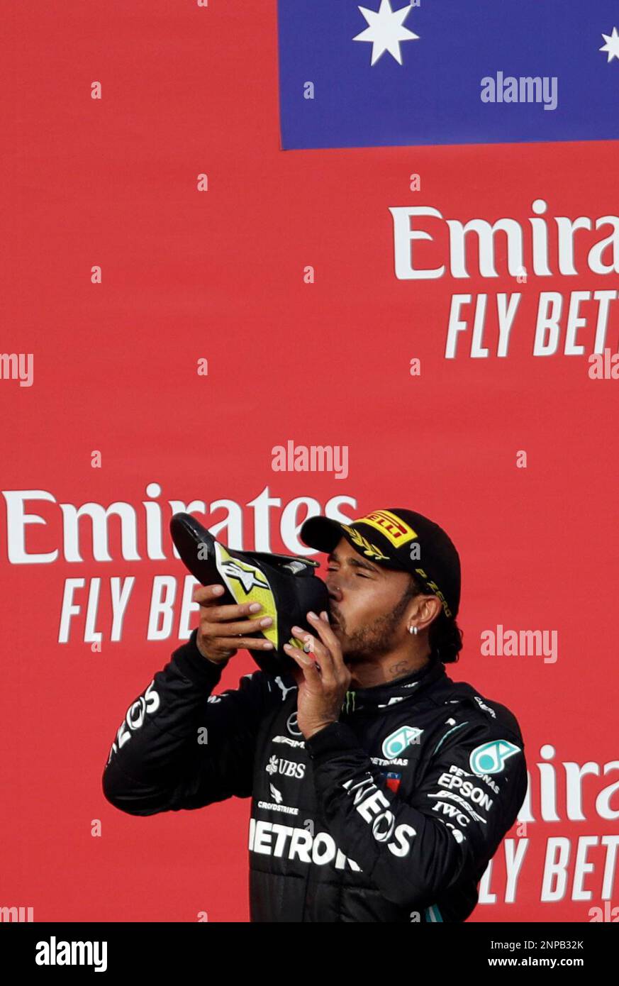 Mercedes driver Lewis Hamilton of Britain celebrates on the podium ...
