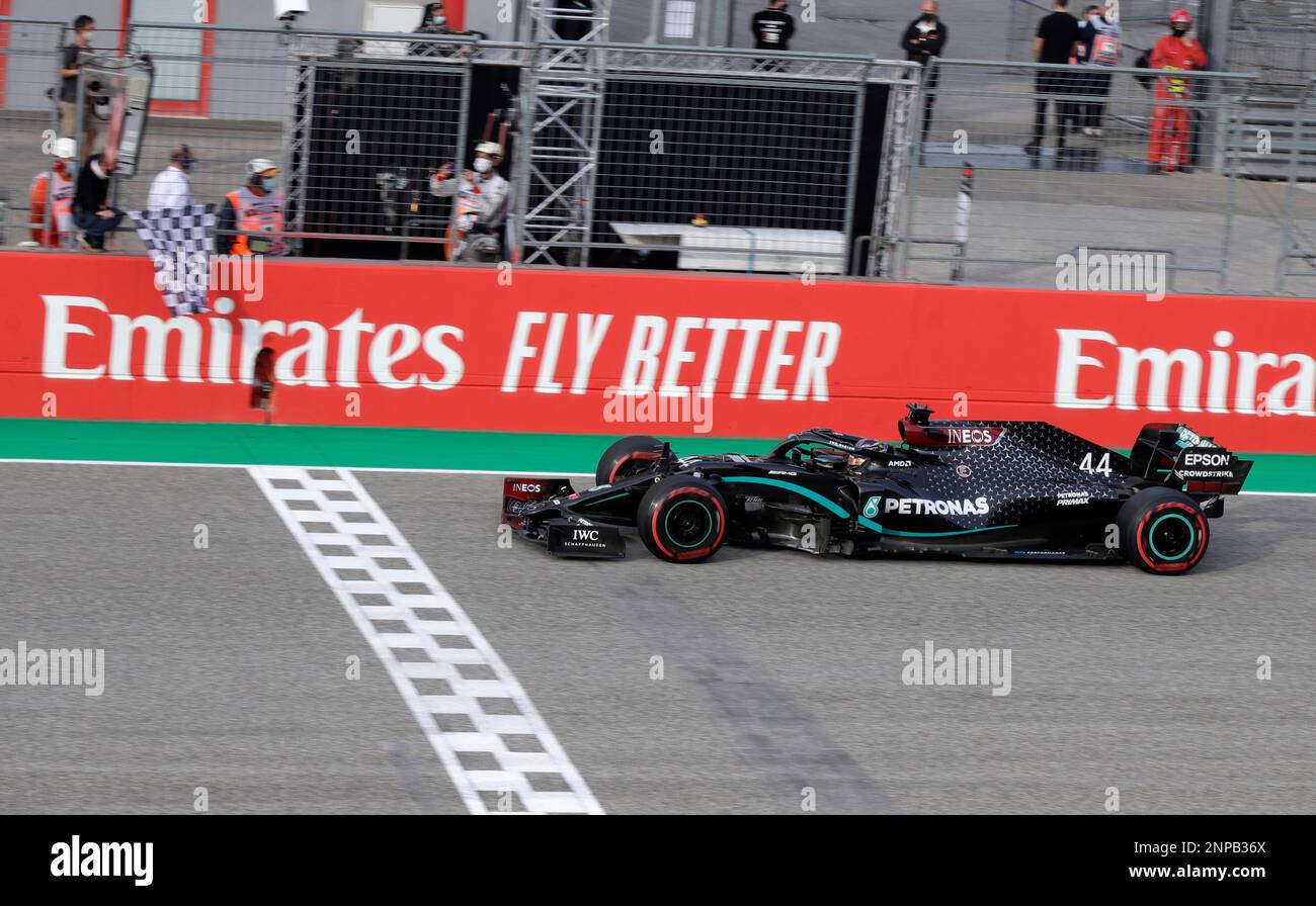 Mercedes driver Lewis Hamilton of Britain crosses the finish to win the ...