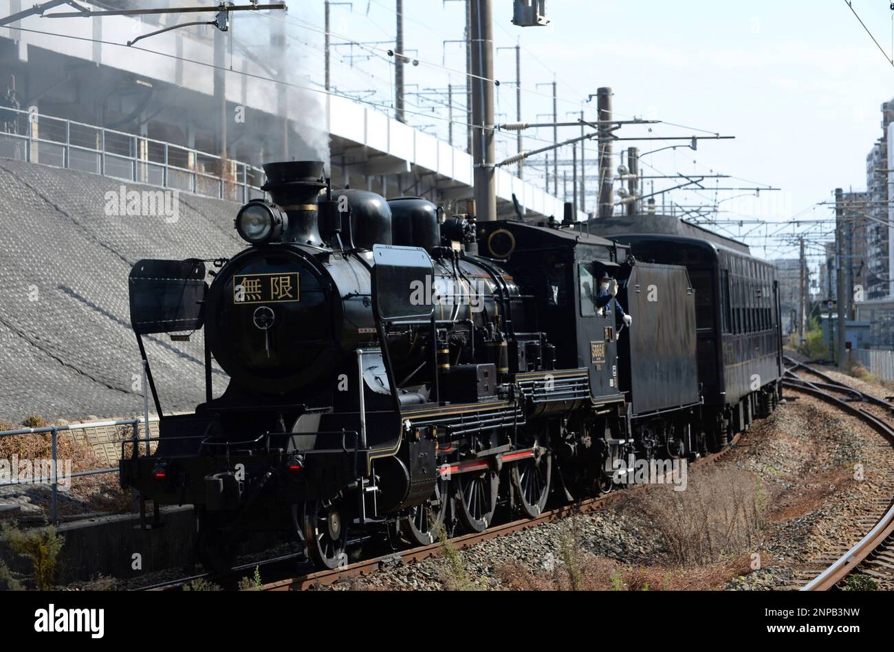 A steam locomotive (SL) train " Kimetsu no Yaiba" train is running in ...