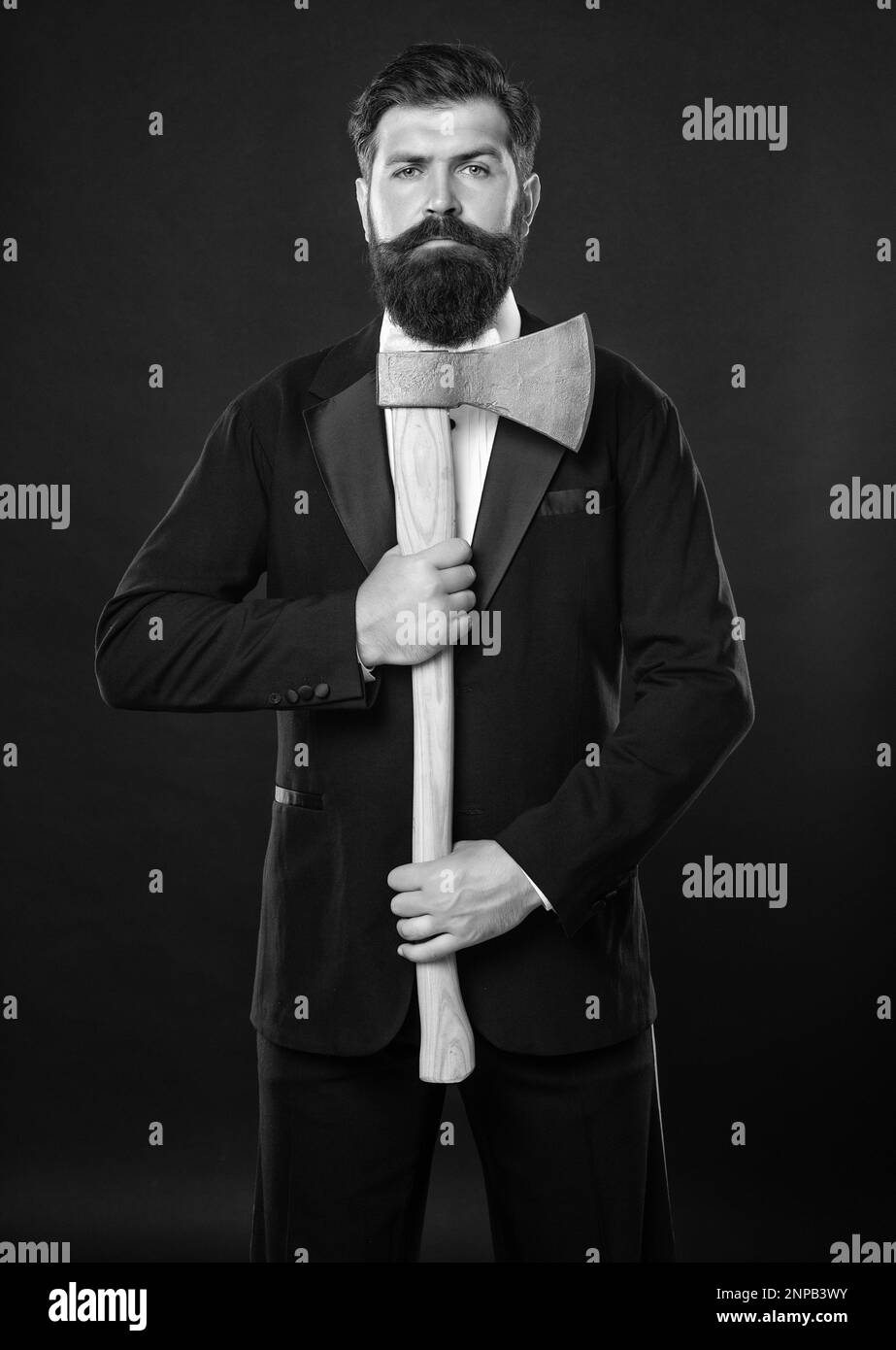 Man in dark suit holding Black and White Stock Photos & Images - Alamy