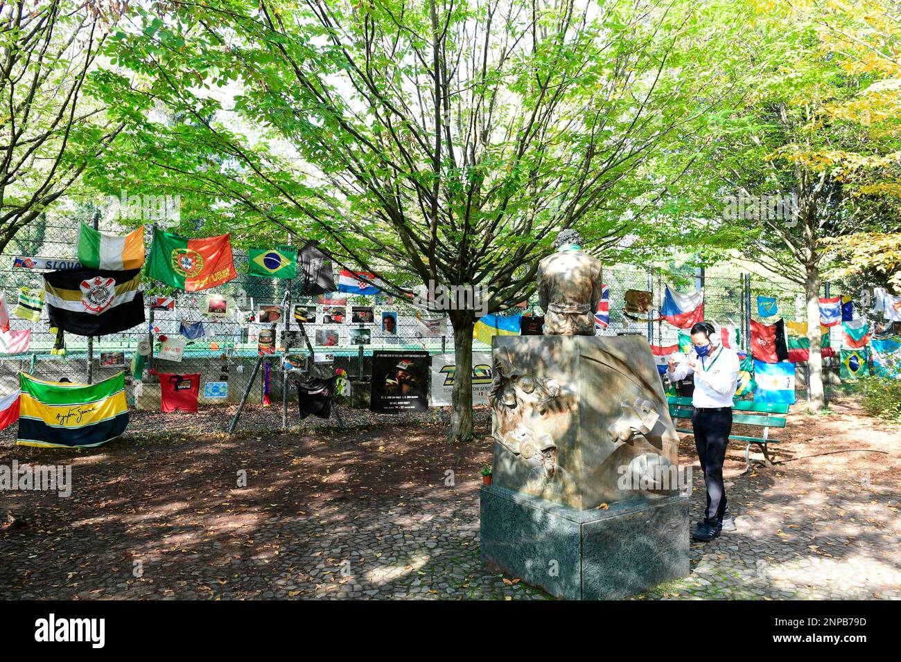 A man takes a picture for the statue of Brazilian race car driver ...