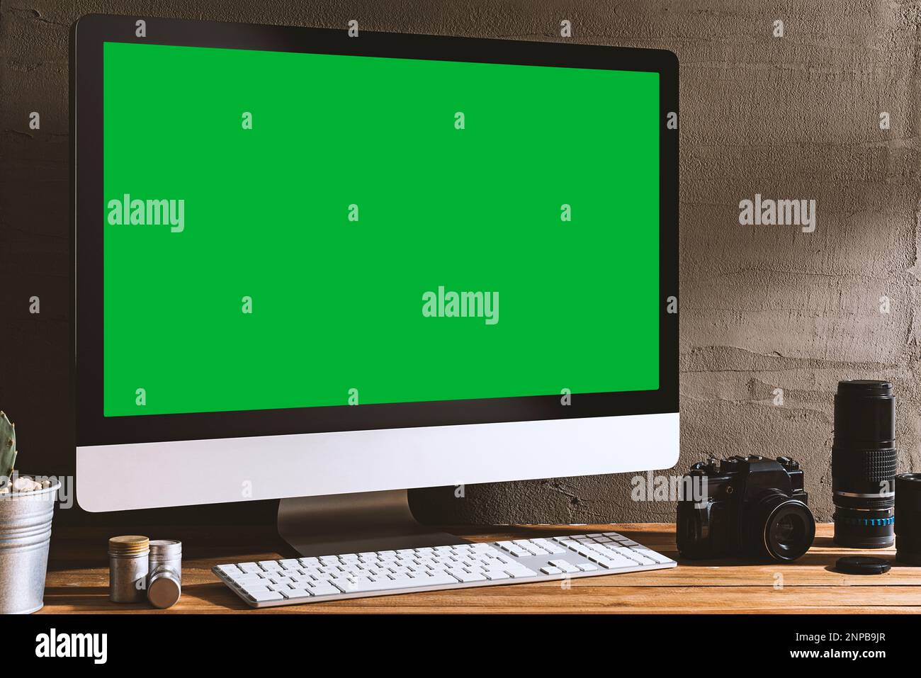 Chroma key green screen, angled view computer on table with photography ...