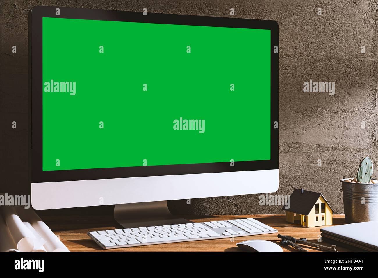Chroma key green screen computer on table with architectural equipment ...