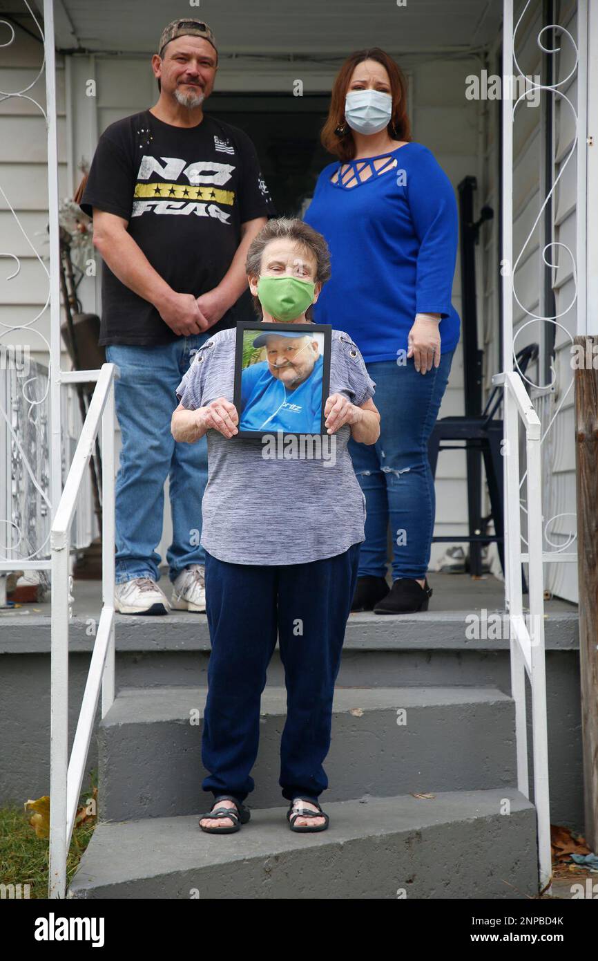 Dean Cooper Jr. and Crystal Horse pose for a portrait with their mother ...