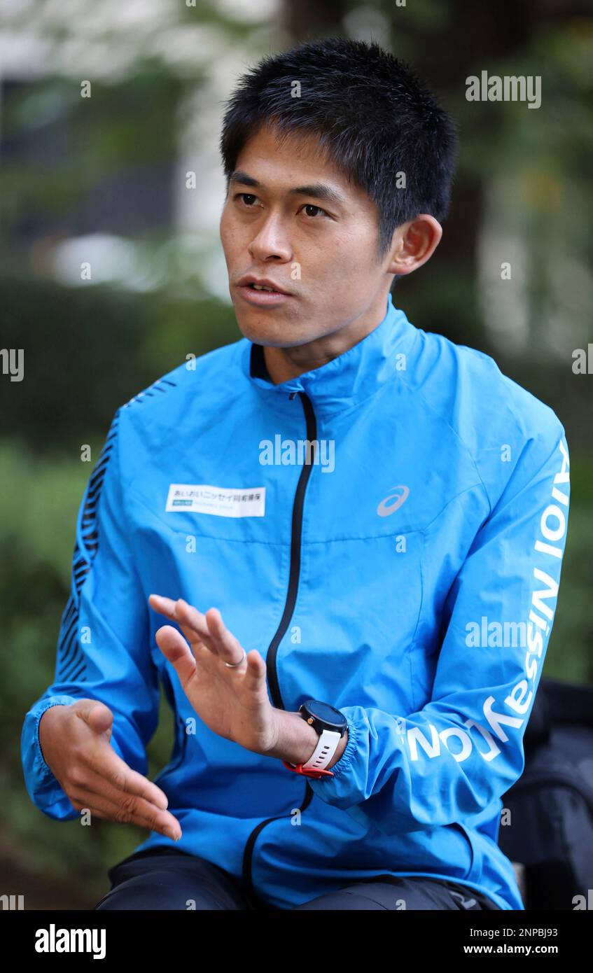 Yuki Kawauchi, a Japanese marathon runner, speaks during an interview ...