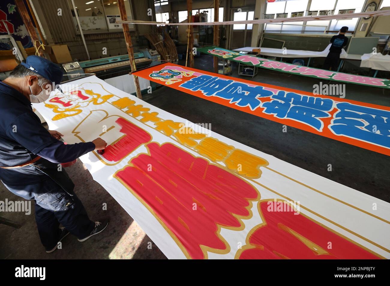 Workers paint Sumo-nobori flags at Ota Flag in Oita City, Oita ...