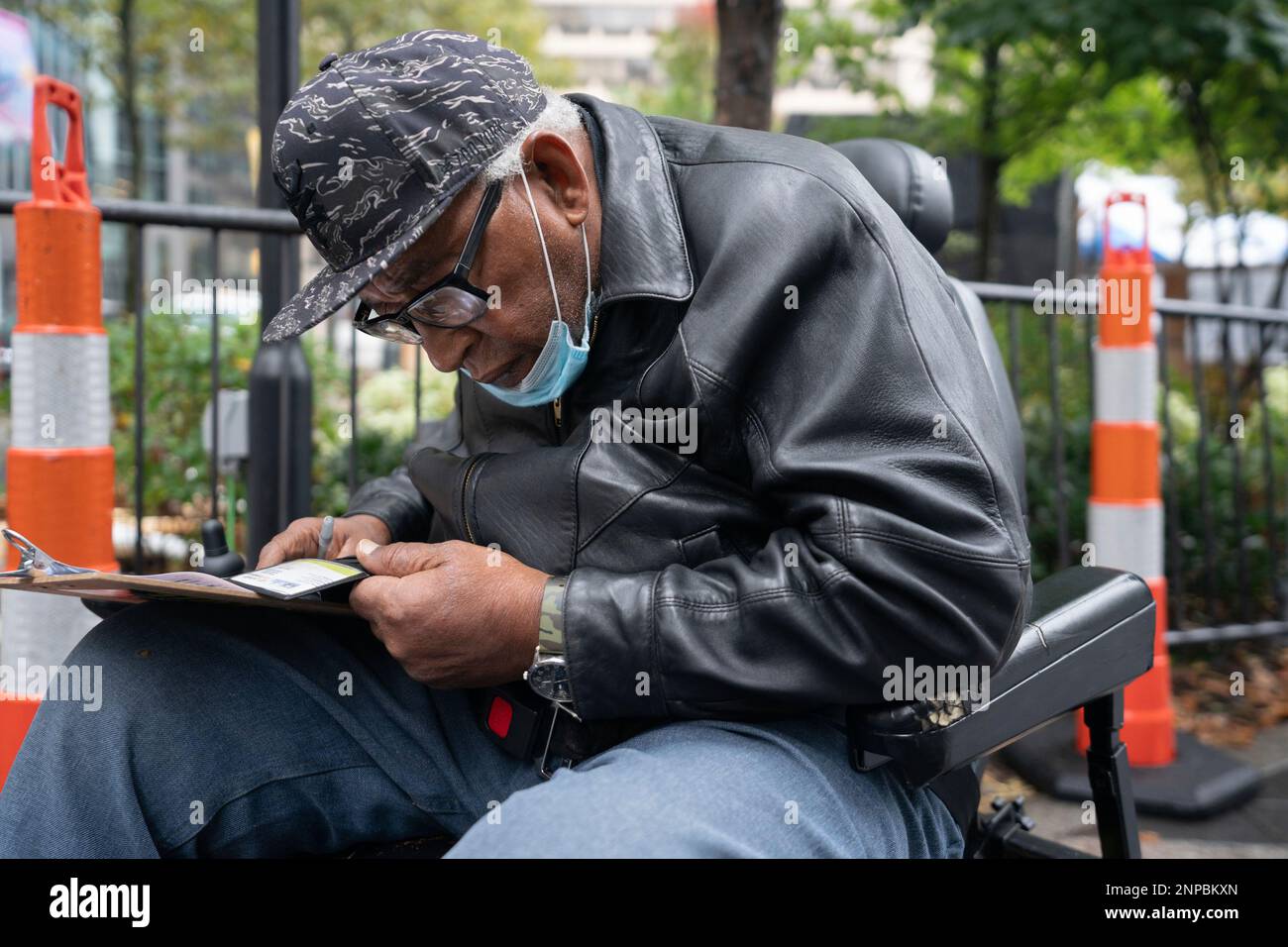 Joseph Wragg waits in line to vote at City Hall in Philadelphia, Monday ...