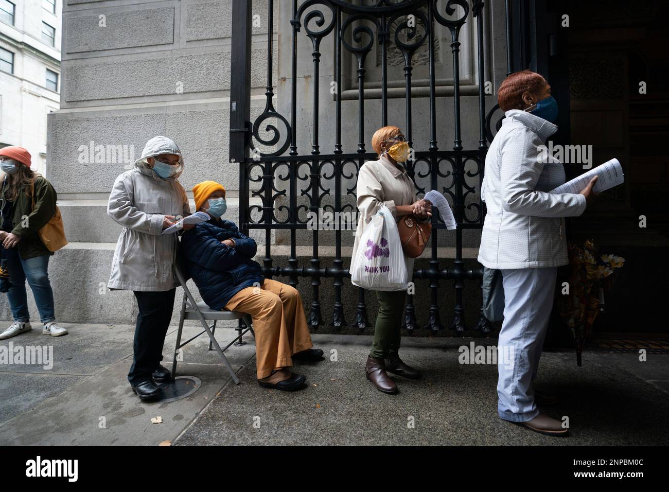Angie Coulter, second from right, Cheryle Coulter, far right, wait in ...