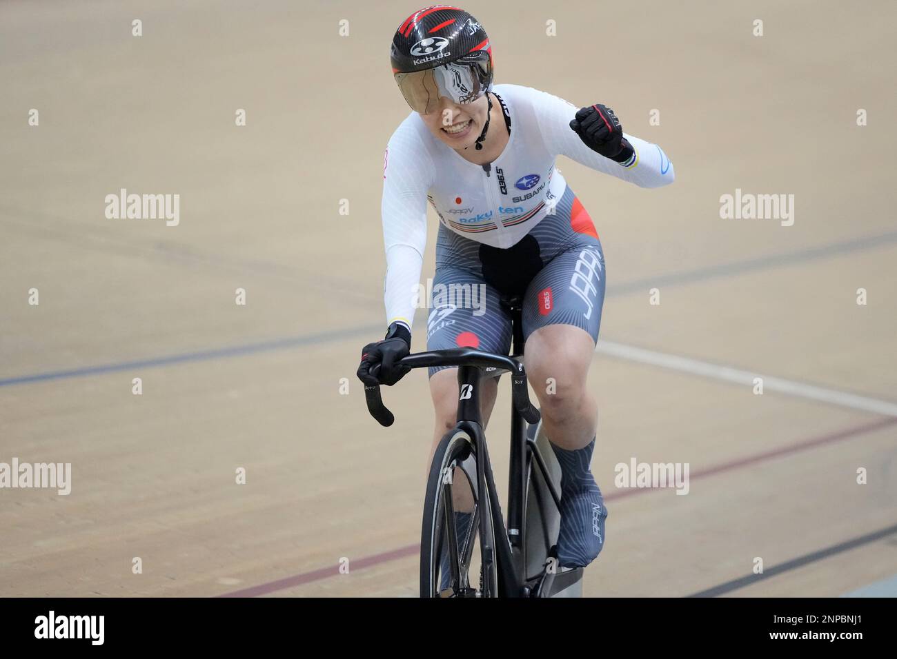 Japan's Mina Sato, left, celebrates after winning the women's keirin ...