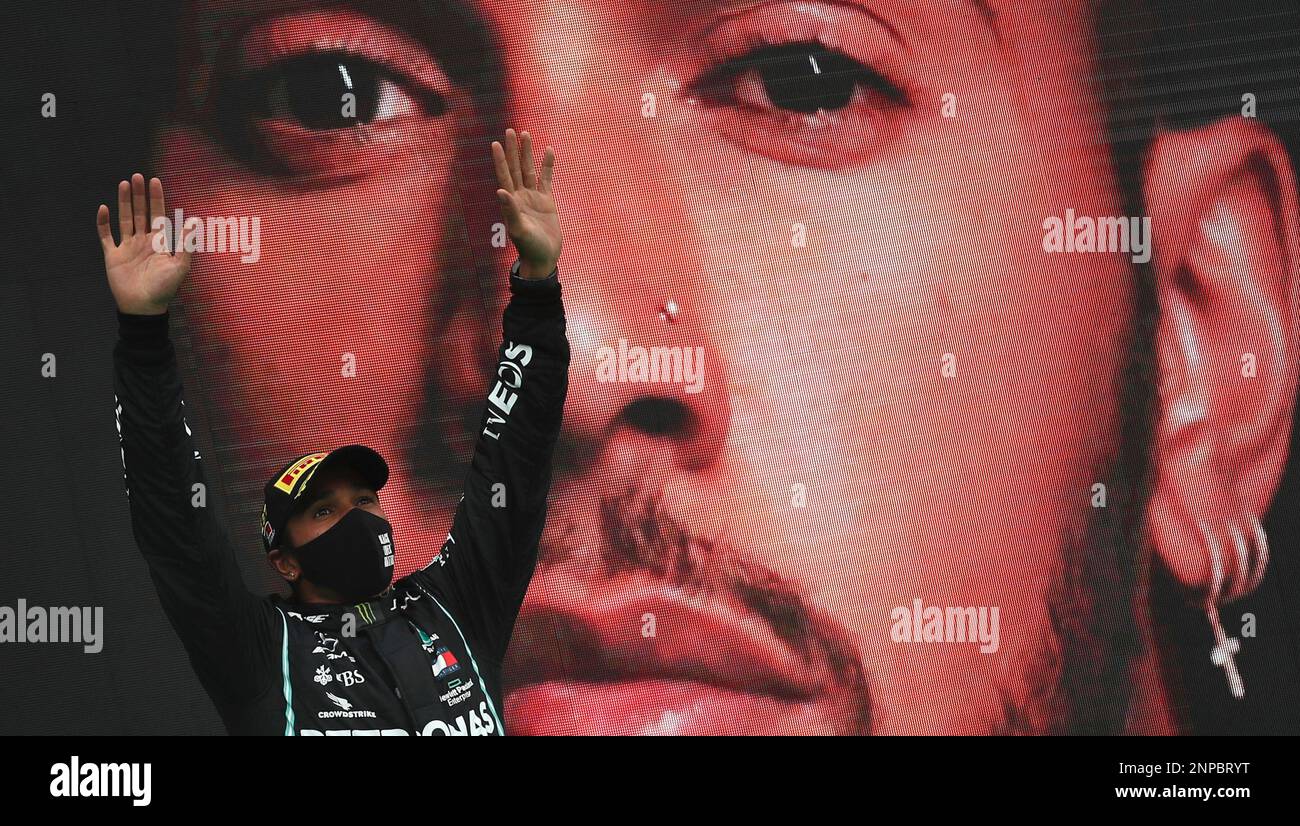 Mercedes driver Lewis Hamilton of Britain waves from the podium after ...