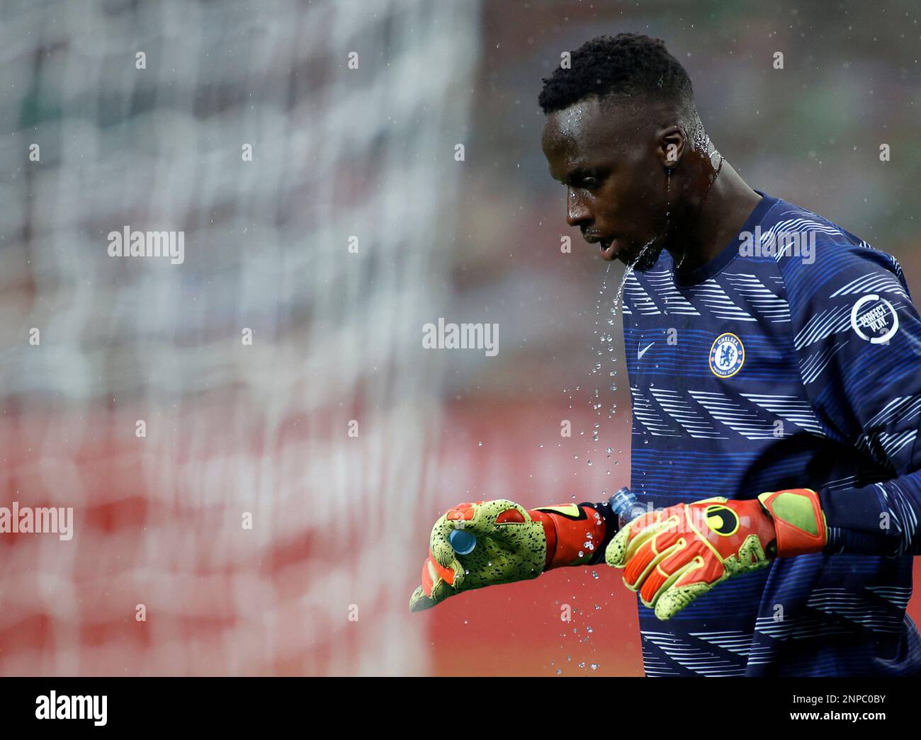 Chelsea's goalkeeper Edouard Mendy refreshes himself during warm up ...