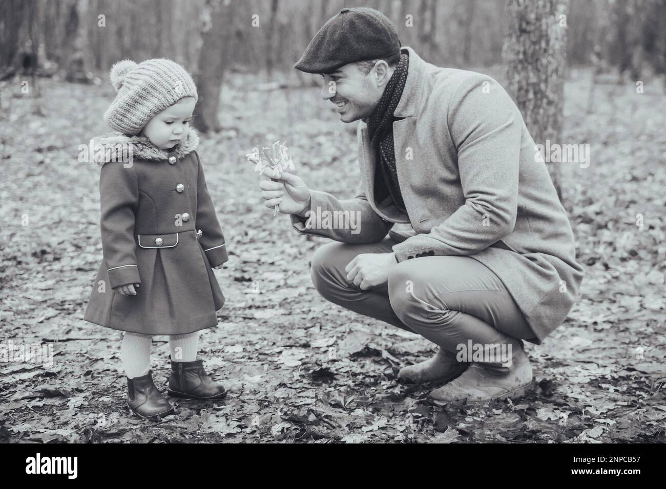 Retro photo of a father giving flowers to a sad daughter Stock Photo ...