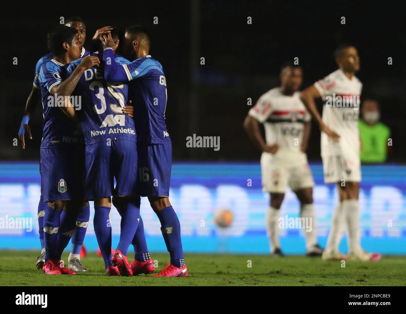 Jean Deza of Peru's Binacional, celebrates with teammates after scoring ...