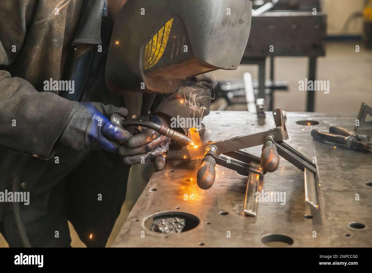 moment of ignition of an electric arc by a welding machine Stock Photo ...