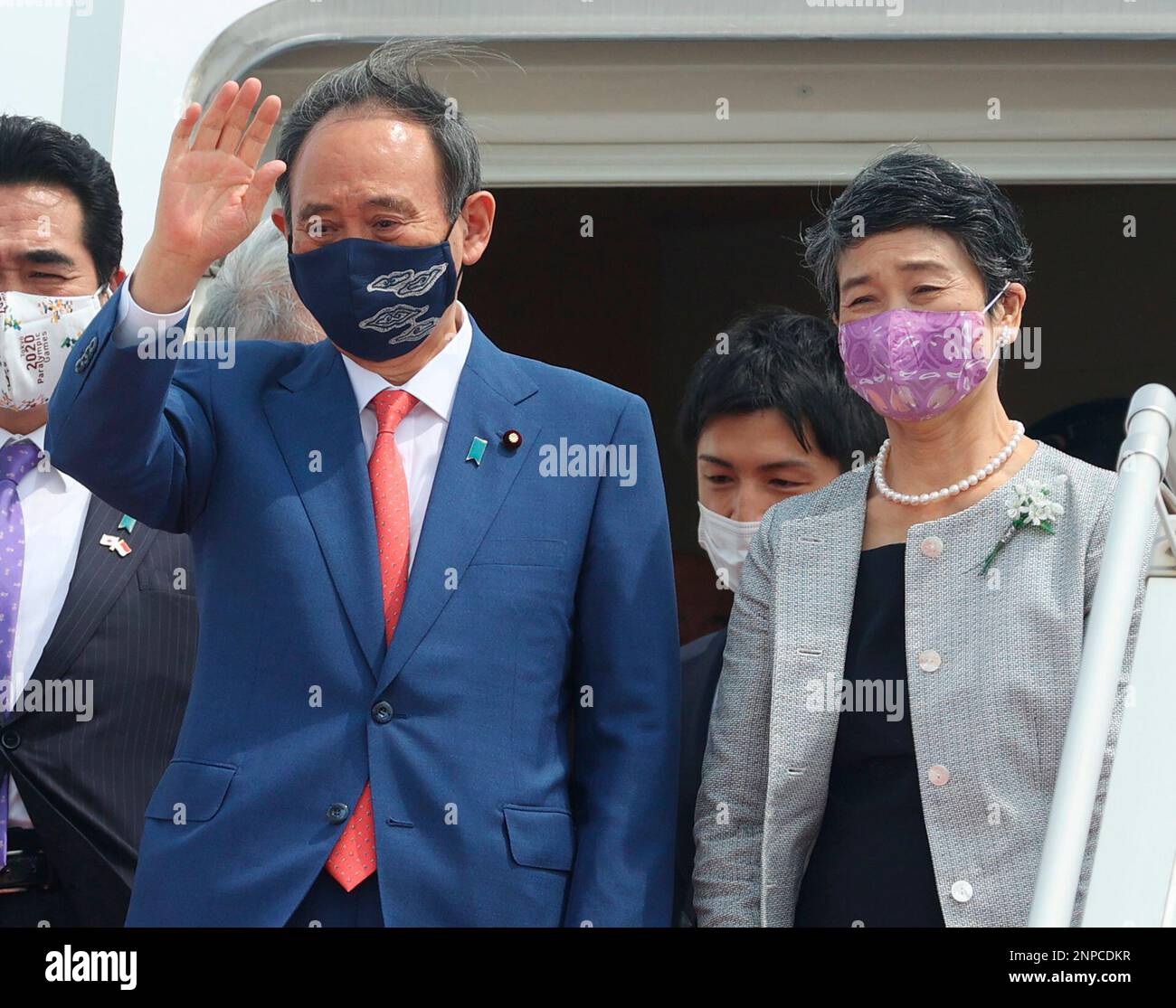 Japanese Prime Minister Yoshihide Suga and his wife Mariko arrive at ...