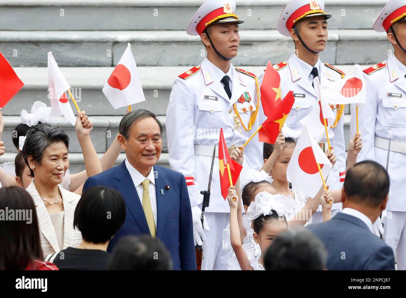 Japanese Prime Minister Yoshihide Suga, second left, and his wife ...