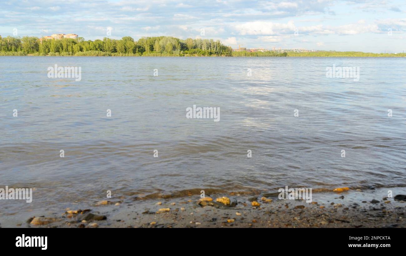 Bank of the city river Ob with houses of the large city of Novosibirsk under construction on the ...
