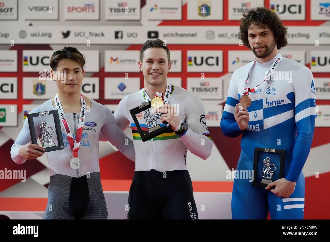 Gold medalist Netherland's Harrie Lavreysen, center, silver medalist ...